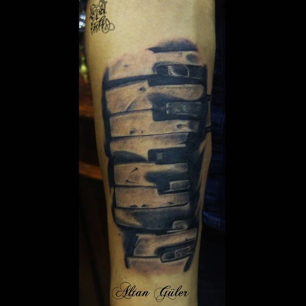 Broken Piano Keys Tattoo